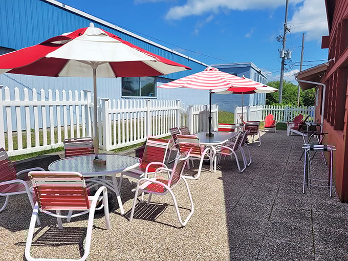 Outdoor seating with red-striped umbrellas—because vitamin D makes cherry pie taste even better. That's just science.