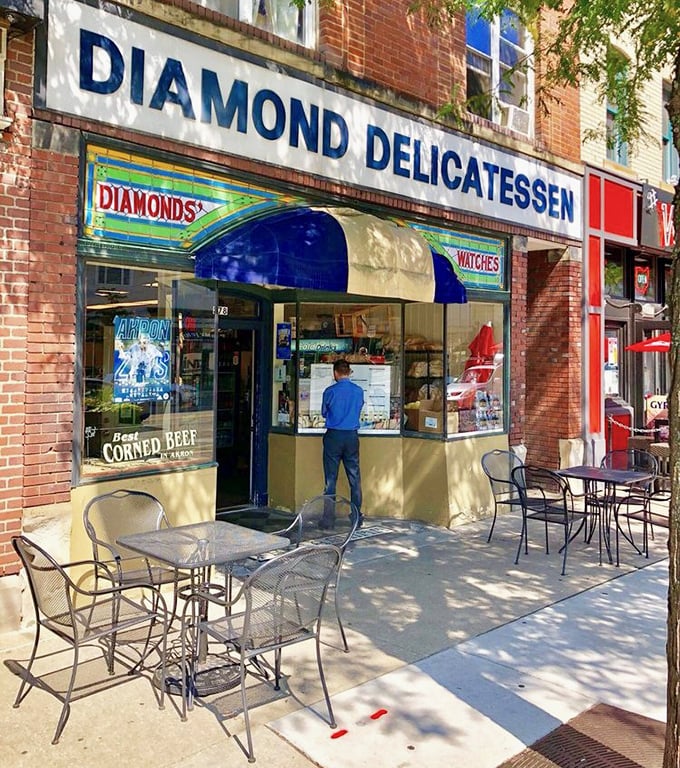 Outdoor seating at Diamond Deli offers the perfect stage for the age-old human drama of trying to eat a massive sandwich with dignity in public.