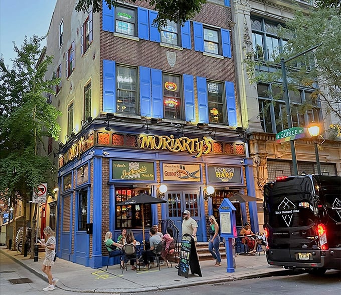 As evening falls, the blue exterior glows with possibility. Sidewalk seating for those who want their wing experience with a side of people-watching.