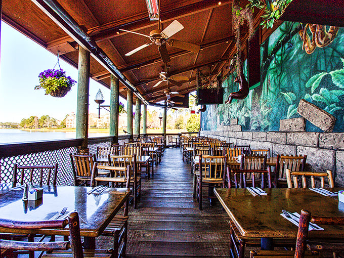 The outdoor dining area offers waterfront views with a side of fresh air – proving that sometimes the best jungle experience includes a gentle breeze.