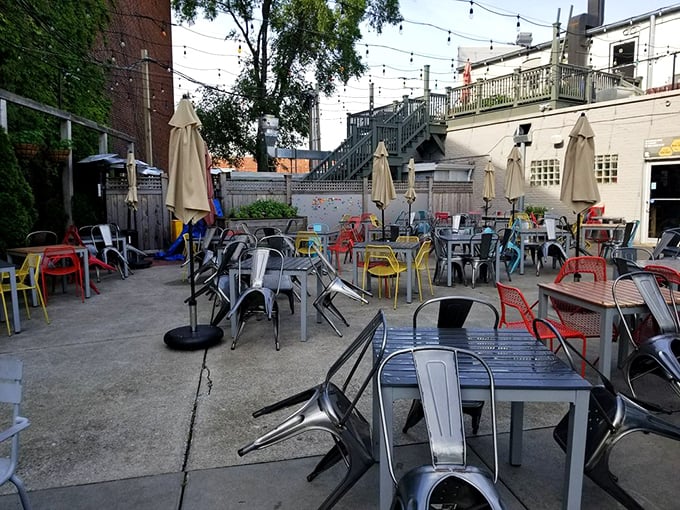 The patio's colorful chairs invite lingering conversations that stretch from lunch well into the afternoon golden hour.