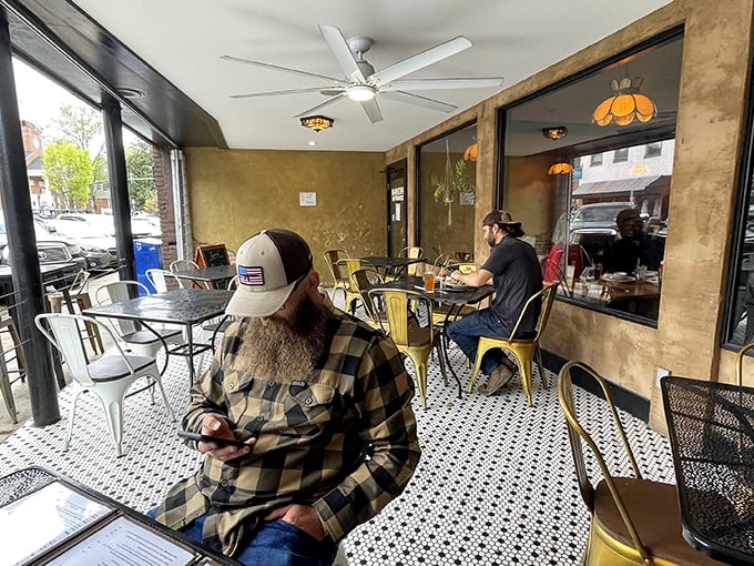 Outdoor dining that lets you soak up small-town charm with your coffee – the kind of people-watching spot that turns visitors into regulars.