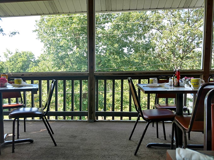 The screened porch offers a view of Missouri greenery – nature's perfect digestif after a meal that demands to be savored.