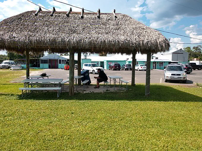 Tiki hut dining for the full Florida experience – where picnic tables and palm fronds create the perfect casual seafood atmosphere.