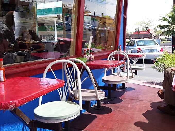 Red and blue outdoor tables provide perfect perches for enjoying Arizona sunshine with your morning meal.