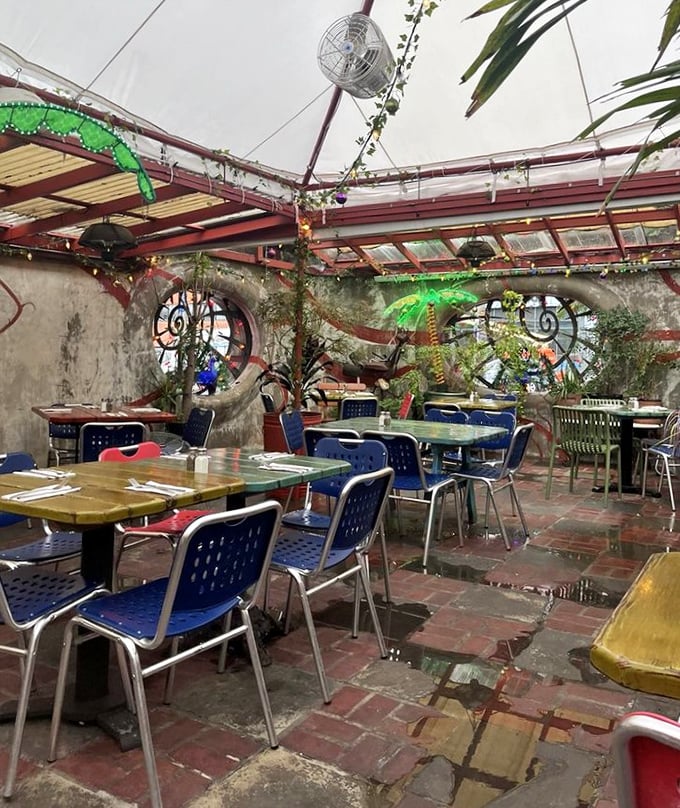 The greenhouse dining area feels like eating in an enchanted garden where industrial chic meets whimsical greenery—and both invite you to stay awhile.