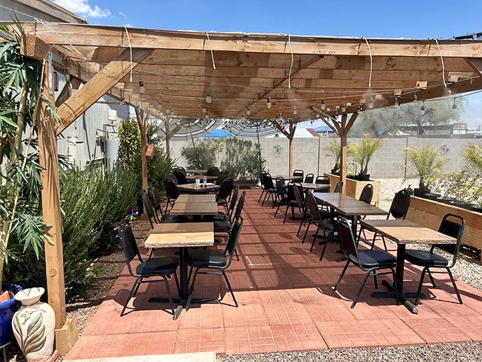 Outdoor dining under a rustic pergola where desert breezes enhance every bite. Arizona sunshine and Mexican flavors—a match made in culinary heaven.