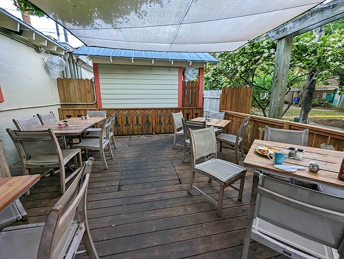 The outdoor seating area offers a tranquil escape—where ocean breezes complement your coffee and the pace slows to perfect vacation tempo.
