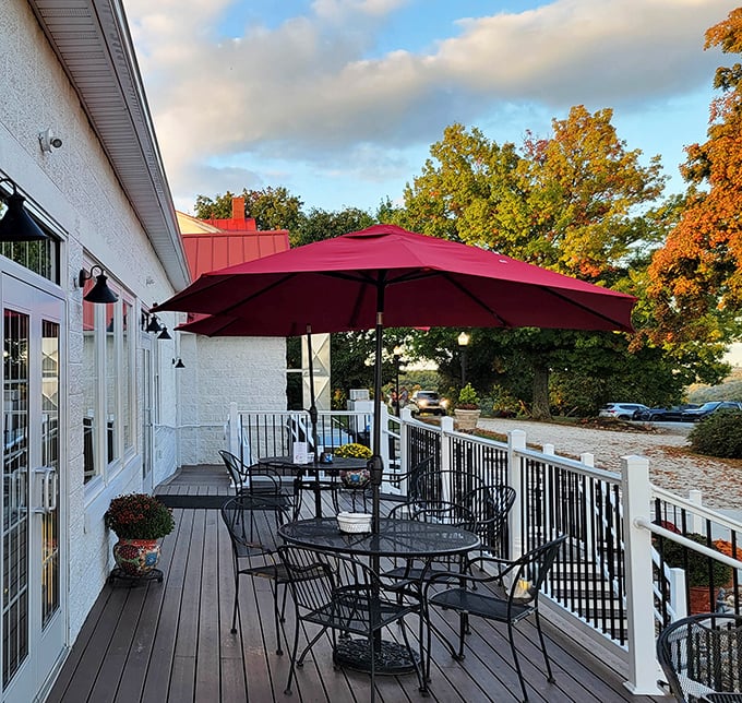 Autumn magic on the deck – where crisp air, falling leaves, and that signature red umbrella create the perfect setting for outdoor dining.