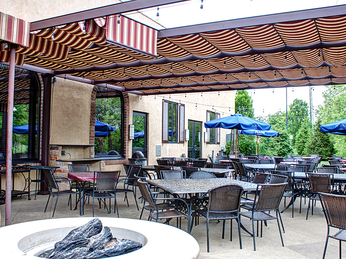 The covered patio offers al fresco dining with all the comforts—string lights overhead and a fireplace nearby for those cooler Ohio evenings.
