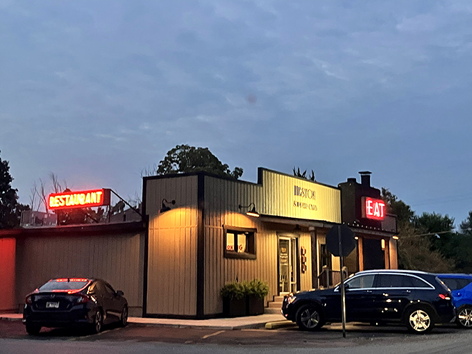 As dusk falls, the neon "EAT" sign becomes a beacon for hungry travelers—like a lighthouse guiding ships to delicious shores.