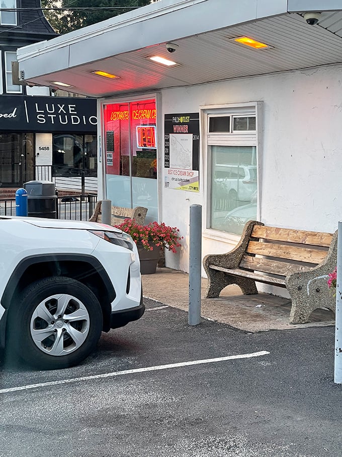 The humble bench outside isn't just seating—it's front-row tickets to the best show in town: people experiencing pure ice cream joy.