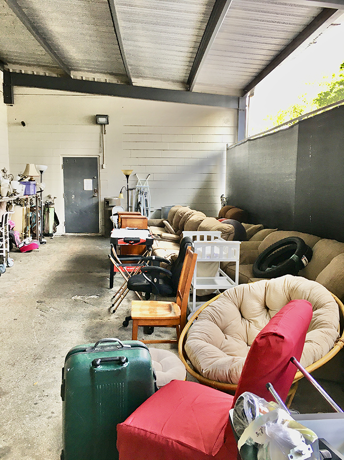 The furniture annex—where sofas, chairs and forgotten home goods bask under fluorescent lights, dreaming of second chances.