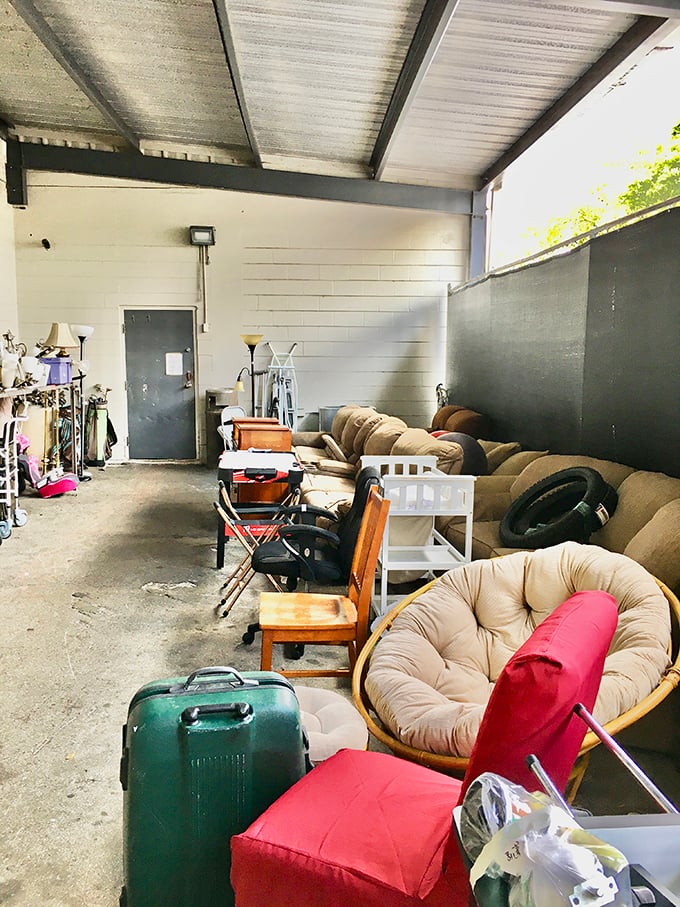 The furniture annex—where sofas, chairs and forgotten home goods bask under fluorescent lights, dreaming of second chances.