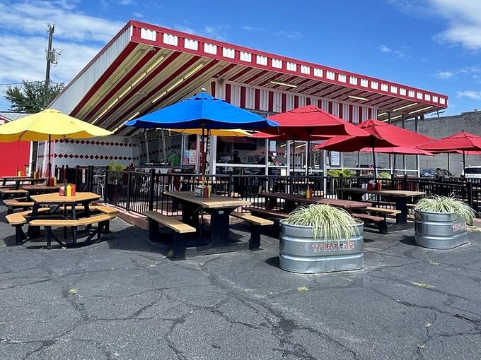The outdoor patio—where summer breezes, colorful umbrellas, and burger perfection create Richmond's happiest place on earth.