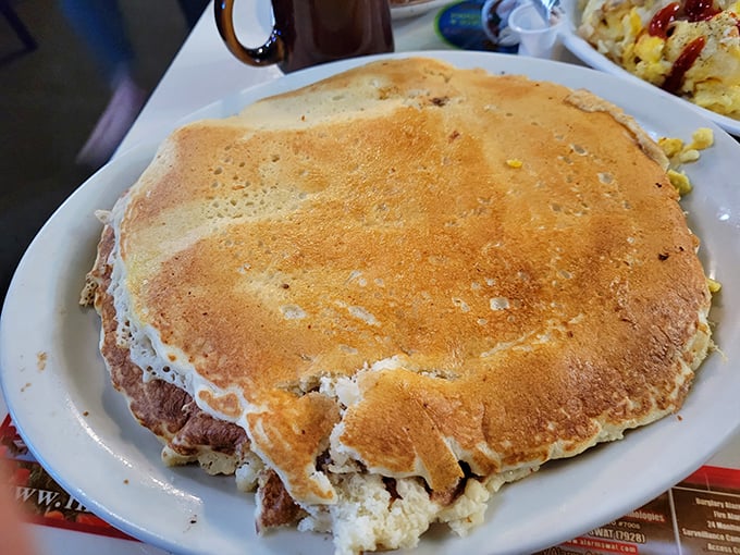 This pancake isn't just large—it's territorially ambitious. If pancakes were real estate, this one would be beachfront property in Malibu.