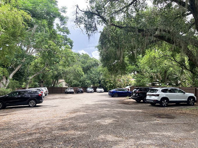 A parking lot shaded by majestic Florida oaks—nature's way of saying "slow down, you're about to experience something worth savoring."