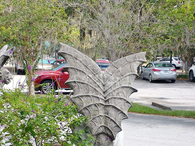 Even the parking lot features whimsical guardians—stone dragon wings that hint at the magical discoveries waiting inside.
