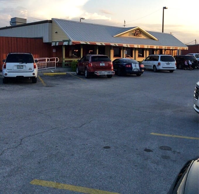Twilight at Fred's – when the parking lot fills with cars and the restaurant glows with promise. Southern comfort food beckons as day turns to evening.