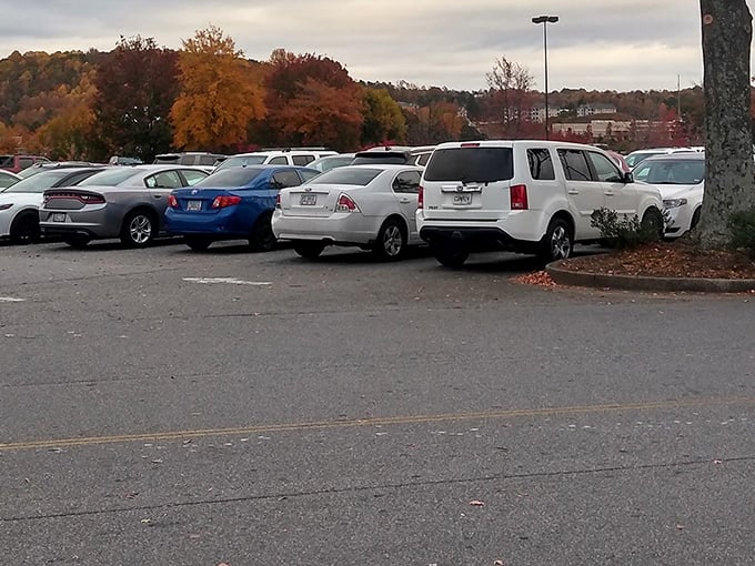 Fall foliage provides a scenic backdrop to the parking lot – nature's way of distracting you from how far you parked.