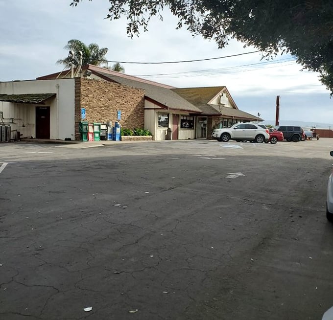 The parking lot—where hungry pilgrims gather before embarking on their journey to burrito enlightenment.