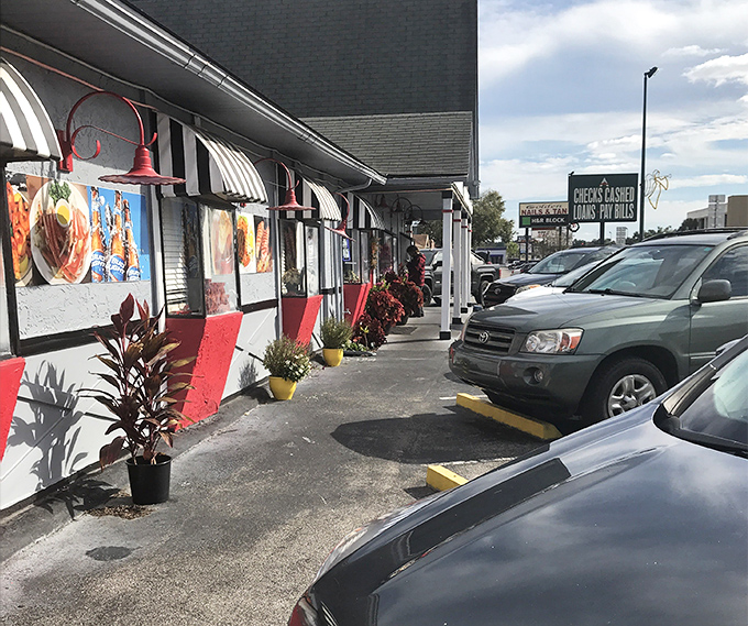 Even the parking lot has personality—food photos on the exterior walls giving you a preview of coming attractions like movie posters.