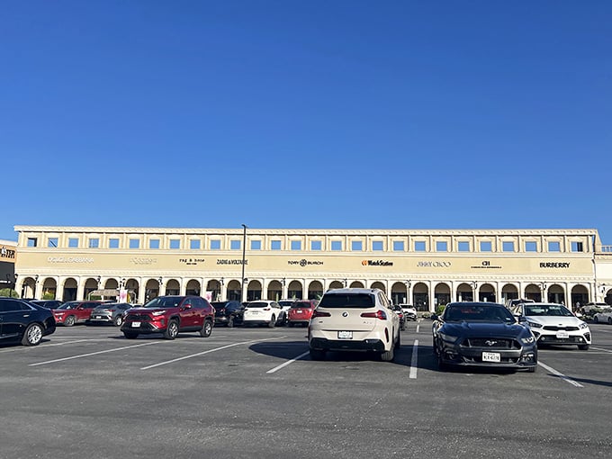 Luxury row under Texas blue skies – where Burberry, Coach, and other high-end brands line up like a fashion runway you can actually walk into.