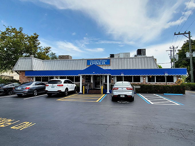 Even the parking lot says "welcome"—convenient spaces just steps away from your next memorable meal in Deerfield Beach.