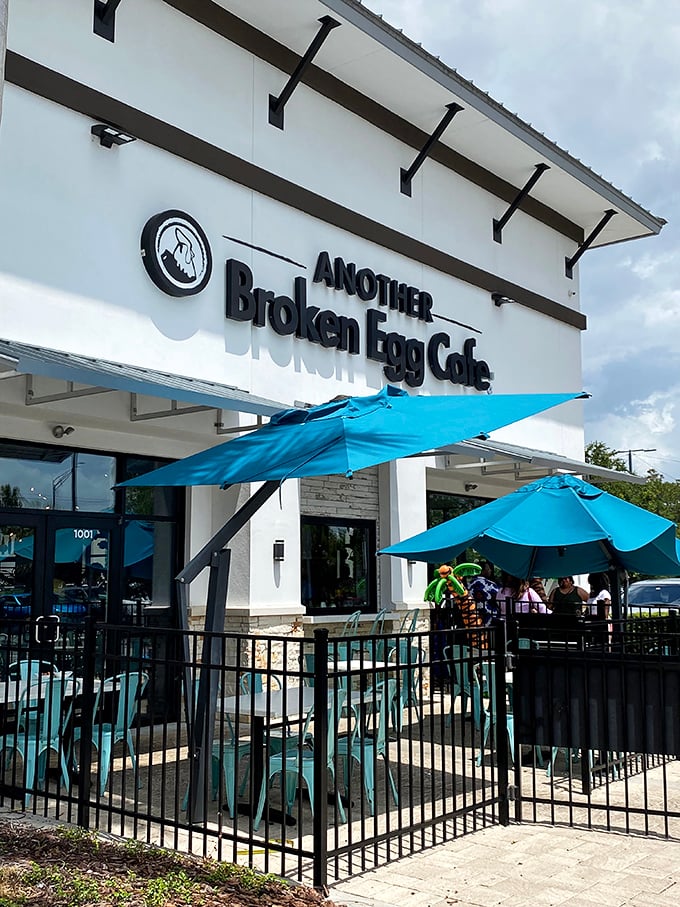 The patio offers al fresco breakfast therapy under those cheerful teal umbrellas. Florida sunshine and waffles—name a better duo.