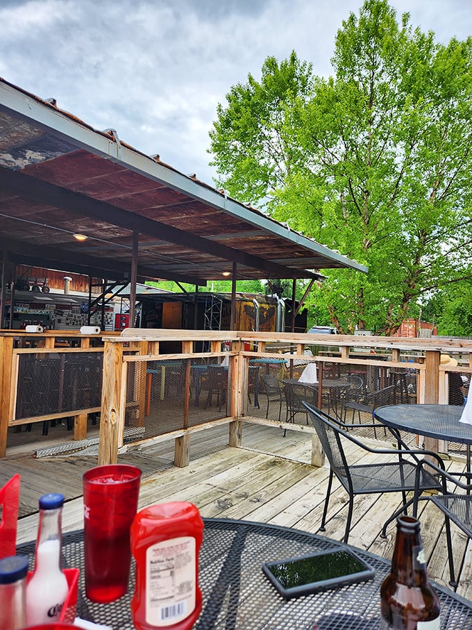 The outdoor patio offers a breath of fresh air between bites of smoky perfection. Nature and barbecue coexist in beautiful harmony here.