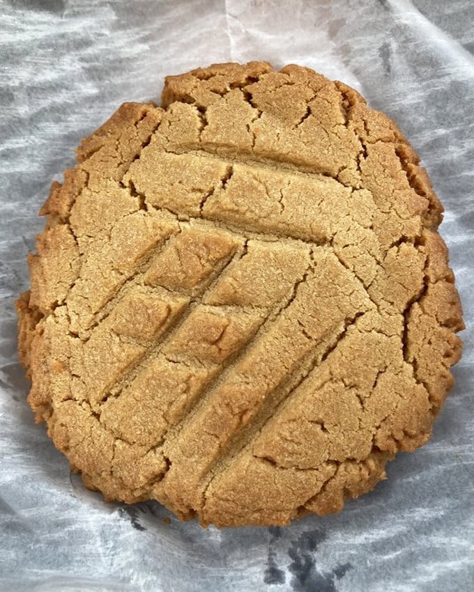 This peanut butter cookie isn't just dessert—it's architecture, engineering, and comfort all wrapped in a perfect golden package.