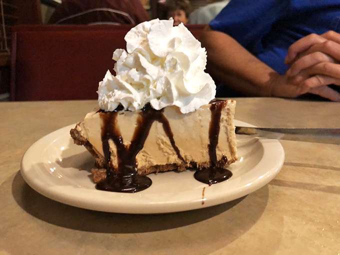 Peanut butter pie with chocolate drizzle and whipped cream—dessert's way of saying "You've made an excellent life choice today."