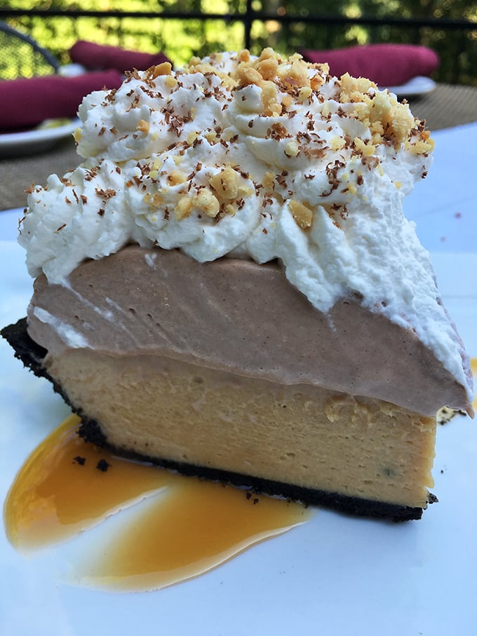 This isn't just dessert—it's therapy in pie form. Layers of chocolate and peanut butter topped with whipped cream and a caramel drizzle.