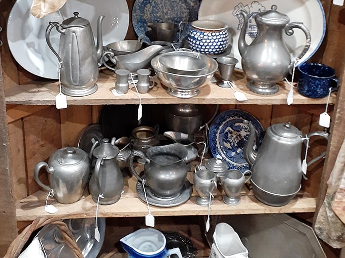 Silver and pewter treasures waiting to be polished back to glory—each piece holding memories of formal dinners and special occasions.