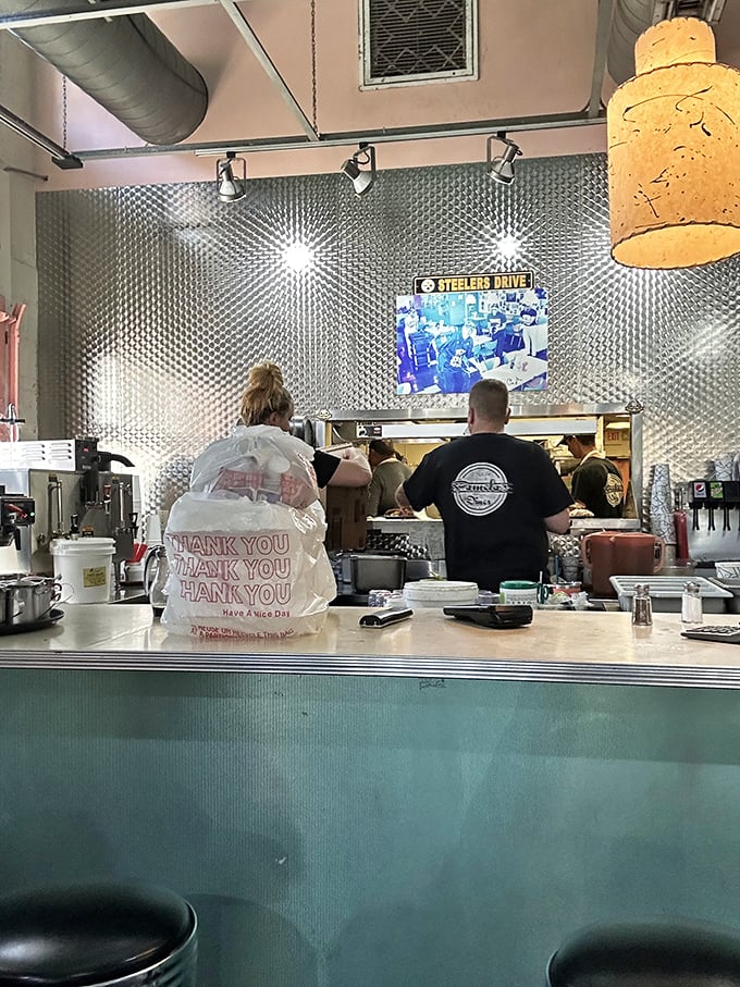 Brick walls and vintage photos create the perfect backdrop for the breakfast theater that unfolds daily at Pamela's.