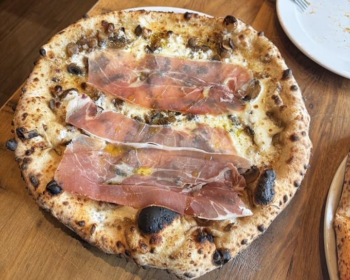 White pizza with prosciutto that makes you wonder why you ever bothered with delivery. This is what pizza dreams about becoming when it grows up.