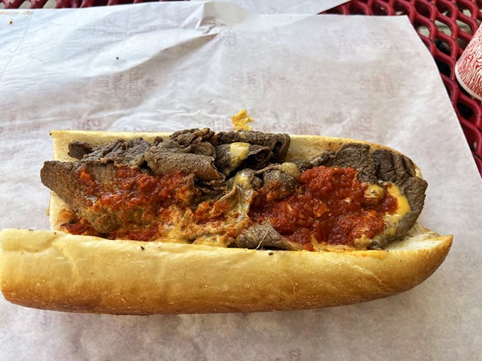 The pizza steak—Pat's brilliant fusion of two comfort foods that proves Philadelphia understands the meaning of "more is more."