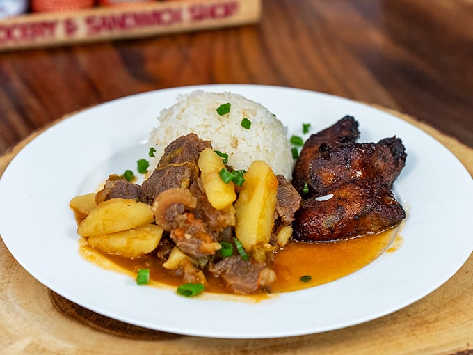 A plate that proves comfort food transcends language barriers – rice, meat, and plantains speaking the universal tongue of delicious.