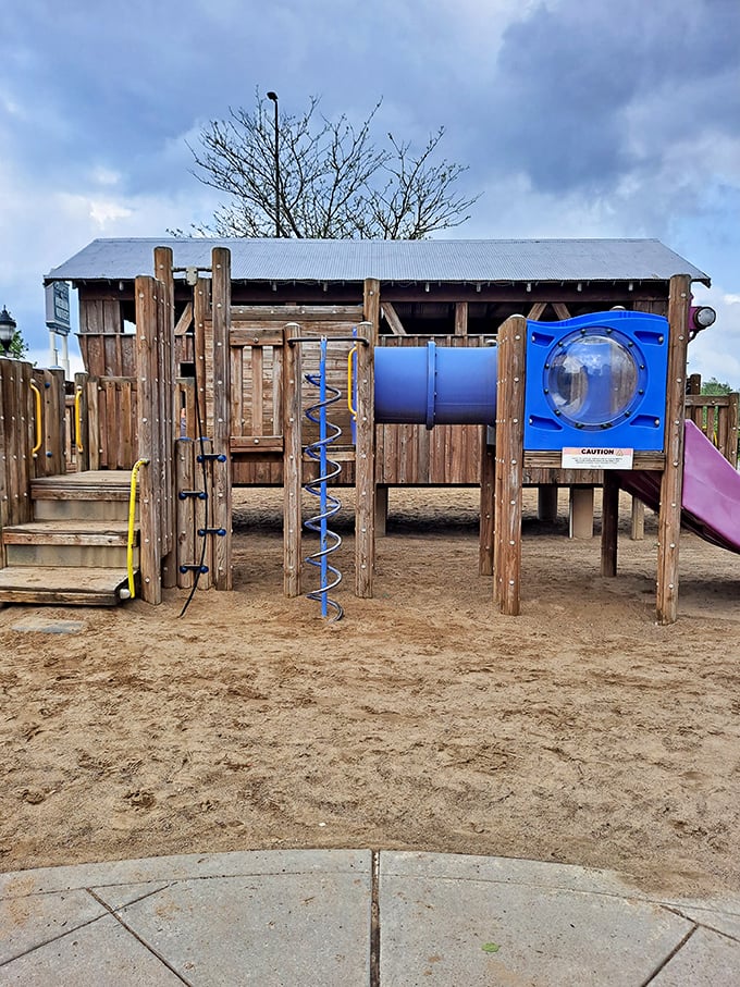 The playground oasis—where children burn energy while parents contemplate burning through their credit limit.