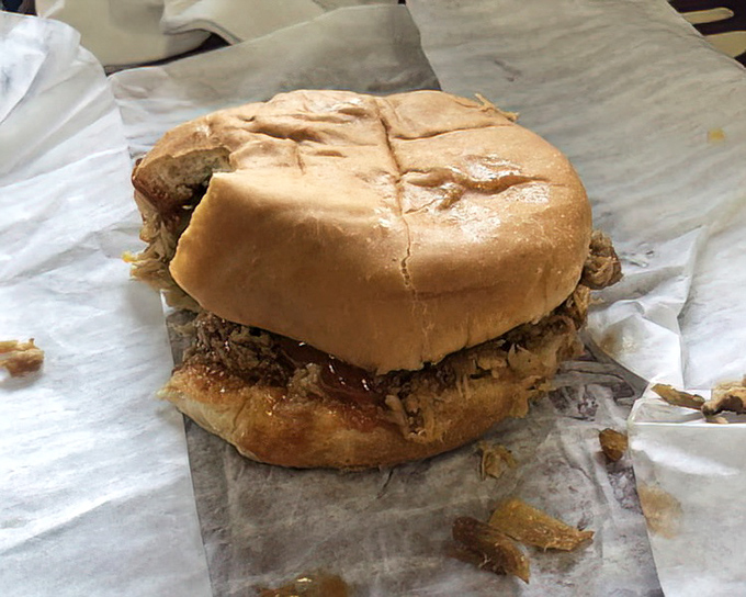 The Chopped Pork Sandwich doesn't need fancy presentation – just a soft bun struggling heroically to contain a mountain of savory meat.