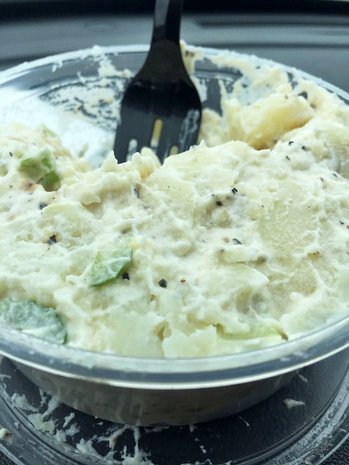 This isn't just potato salad—it's a creamy, herb-flecked side dish that refuses to be overshadowed by its sandwich companions. The perfect supporting actor.