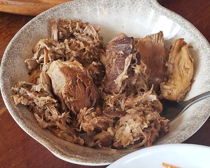 Pulled pork so tender it practically surrendered to the fork before you even touched it. Smoky, succulent, and worth every napkin.