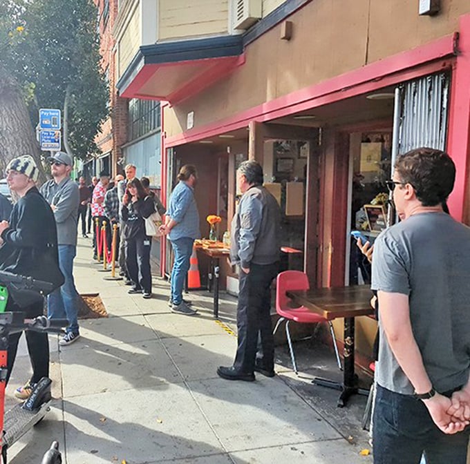 The line stretches down the block – a testament to what happens when word gets out about exceptional pastrami.