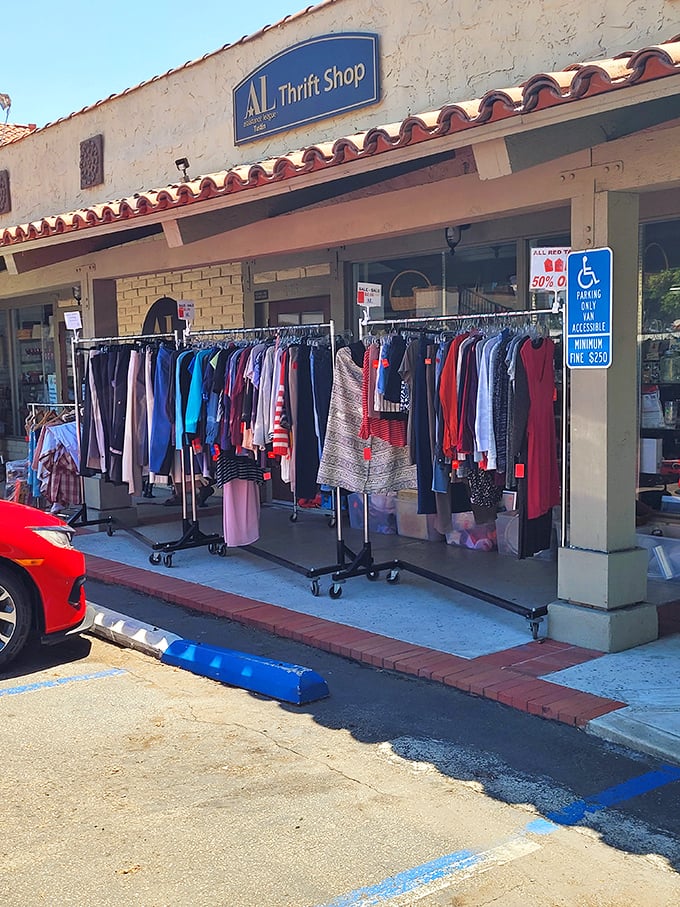 Sidewalk shopping adds to the treasure hunt experience – these racks of colorful clothing beckon to passing cars like a siren song of savings.