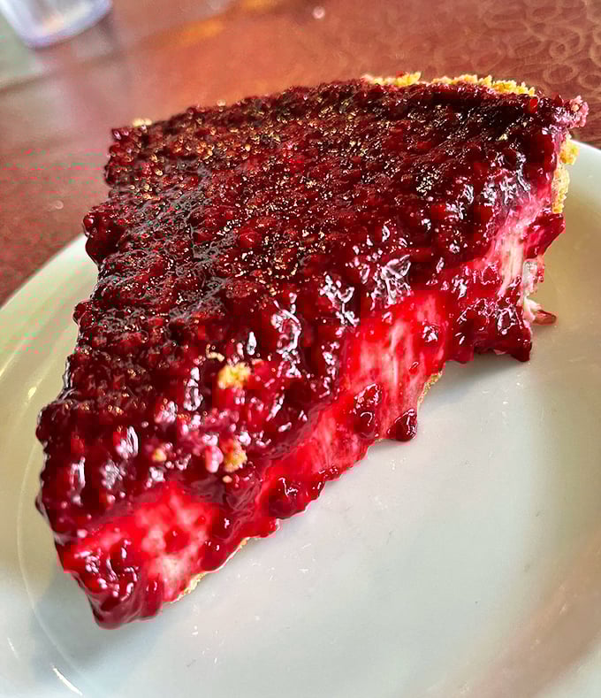 This raspberry key lime pie doesn't just flirt with your taste buds—it proposes marriage with its perfect balance of sweet and tart.