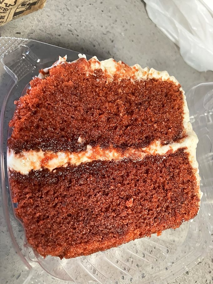 Red velvet cake that doesn't try to be fancy—just deeply satisfying layers of crimson cake and cream cheese frosting that taste like someone's grandmother made it.