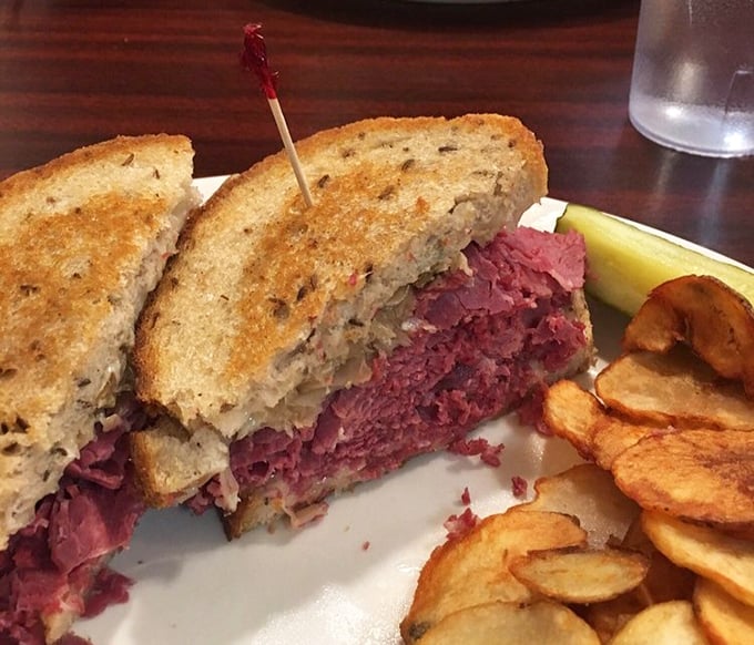 The Reuben sandwich—a tower of corned beef excellence that requires both hands and several napkins. Worth every messy bite.