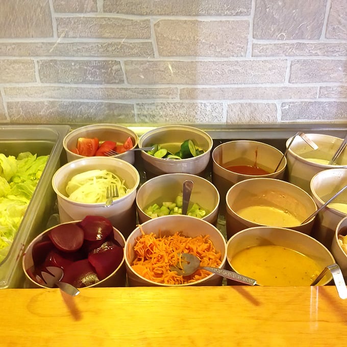 The salad bar—a colorful prelude to the main event. Those beets and shredded carrots are making valiant efforts to add nutrition to your steakhouse experience.