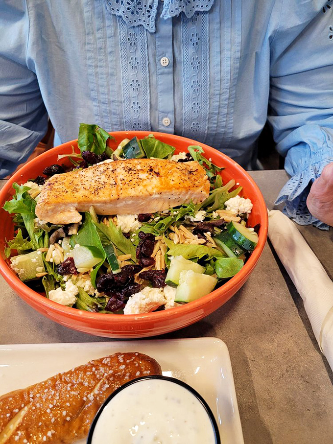 A vibrant salmon salad that proves healthy eating needn't be punishment. That perfectly cooked fish atop fresh greens is practically showing off.