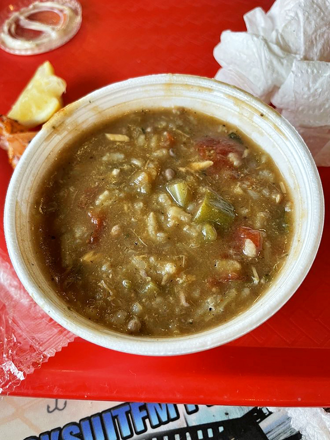 Gumbo that tells stories of the Gulf – a rich, soulful bowl brimming with seafood treasures and decades of culinary wisdom.